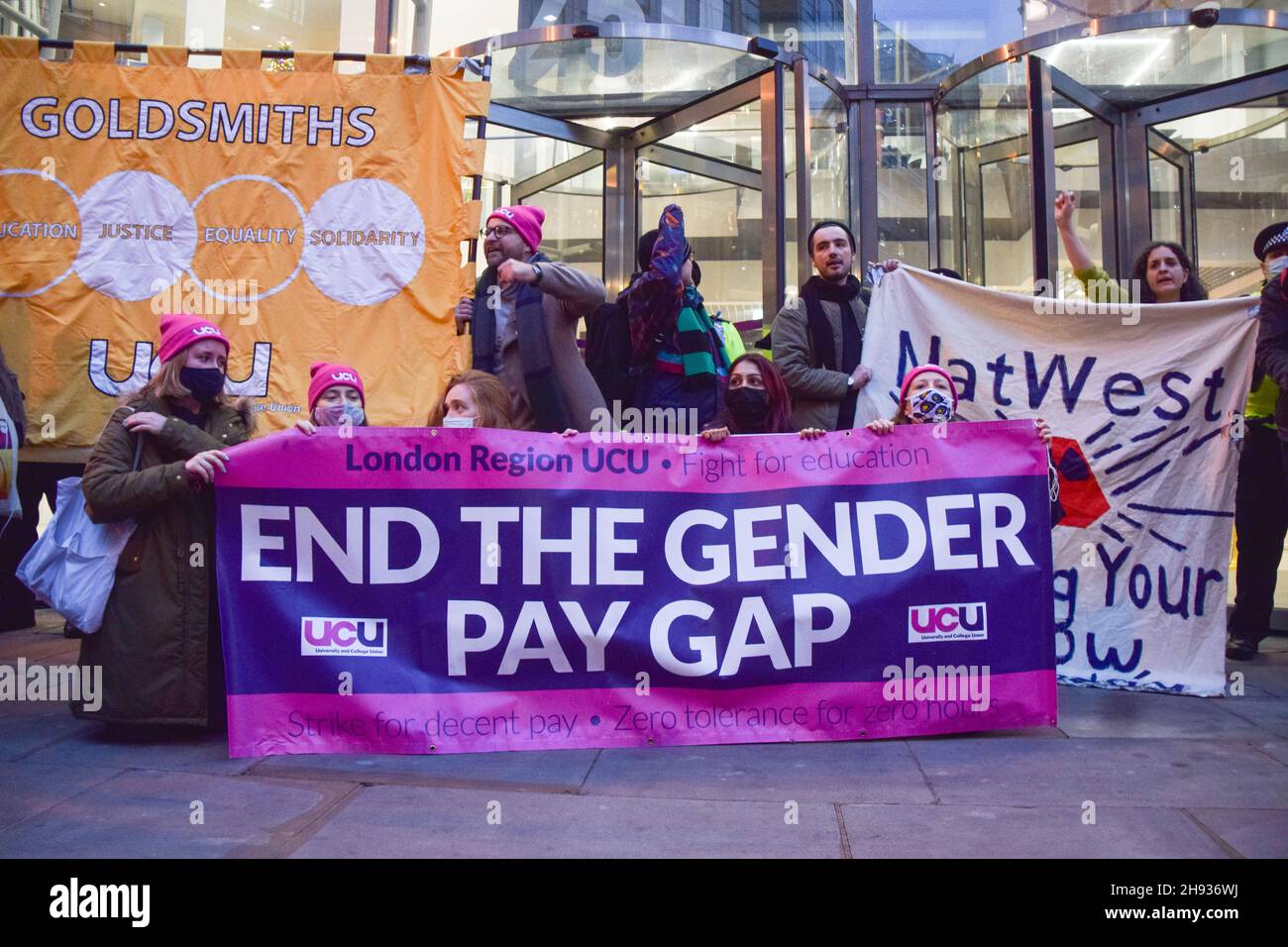 London, UK. 03rd Dec, 2021. Protesters hold an 'End The Gender Pay Gap ...