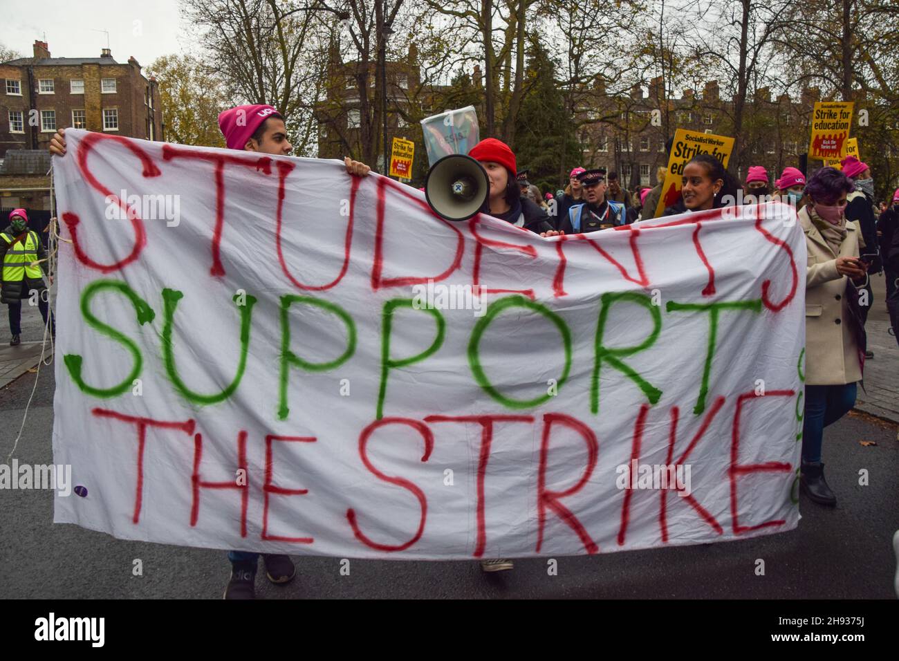 Protesters hold a 'Students Support The Strike' banner during the ...