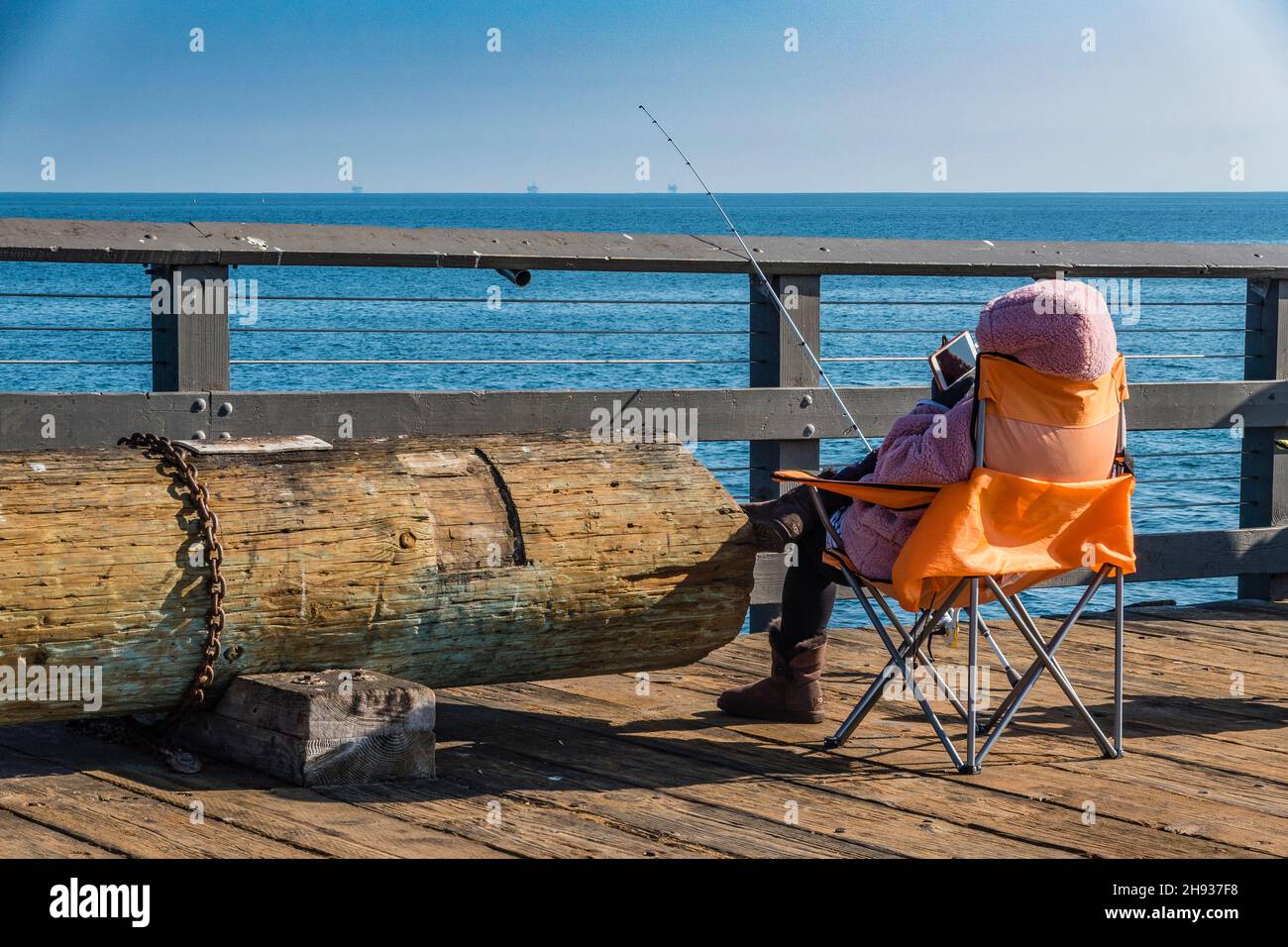 Female fishing off pier hi-res stock photography and images - Alamy