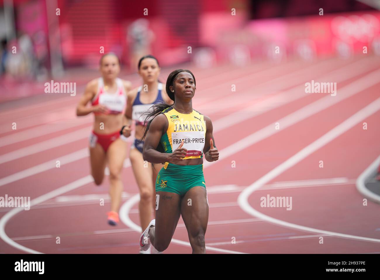 Shelly-Ann Fraser-Pryce competing in the 100 meters of the 2020 Tokyo ...