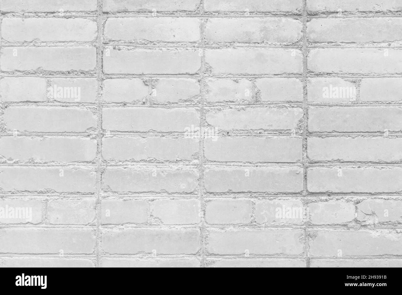 Non-standard irregular amateur brickwork blocks white stone wall ...