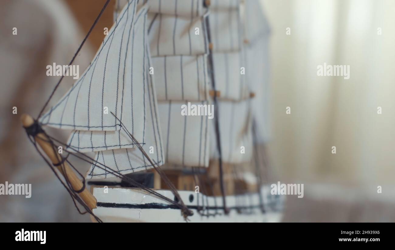 Close-up of the little marine white ship model from the wood on a ...