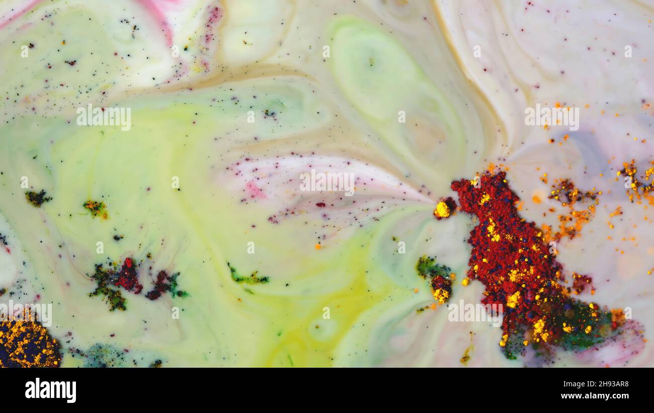 Close-up of colorful powder paint on water. Abstract art drawing of ...