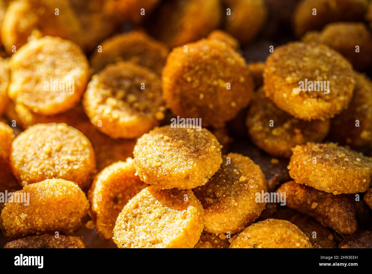 Close up macro shot of tasty golden brown dry cat food , special ...