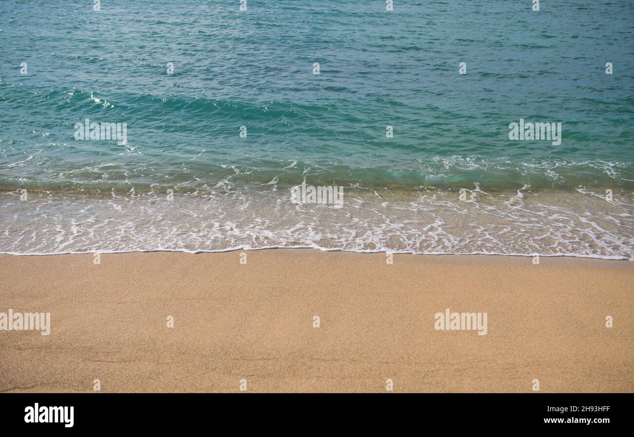 Beach background. Calm beautiful ocean wave on sandy beach. Sea view ...