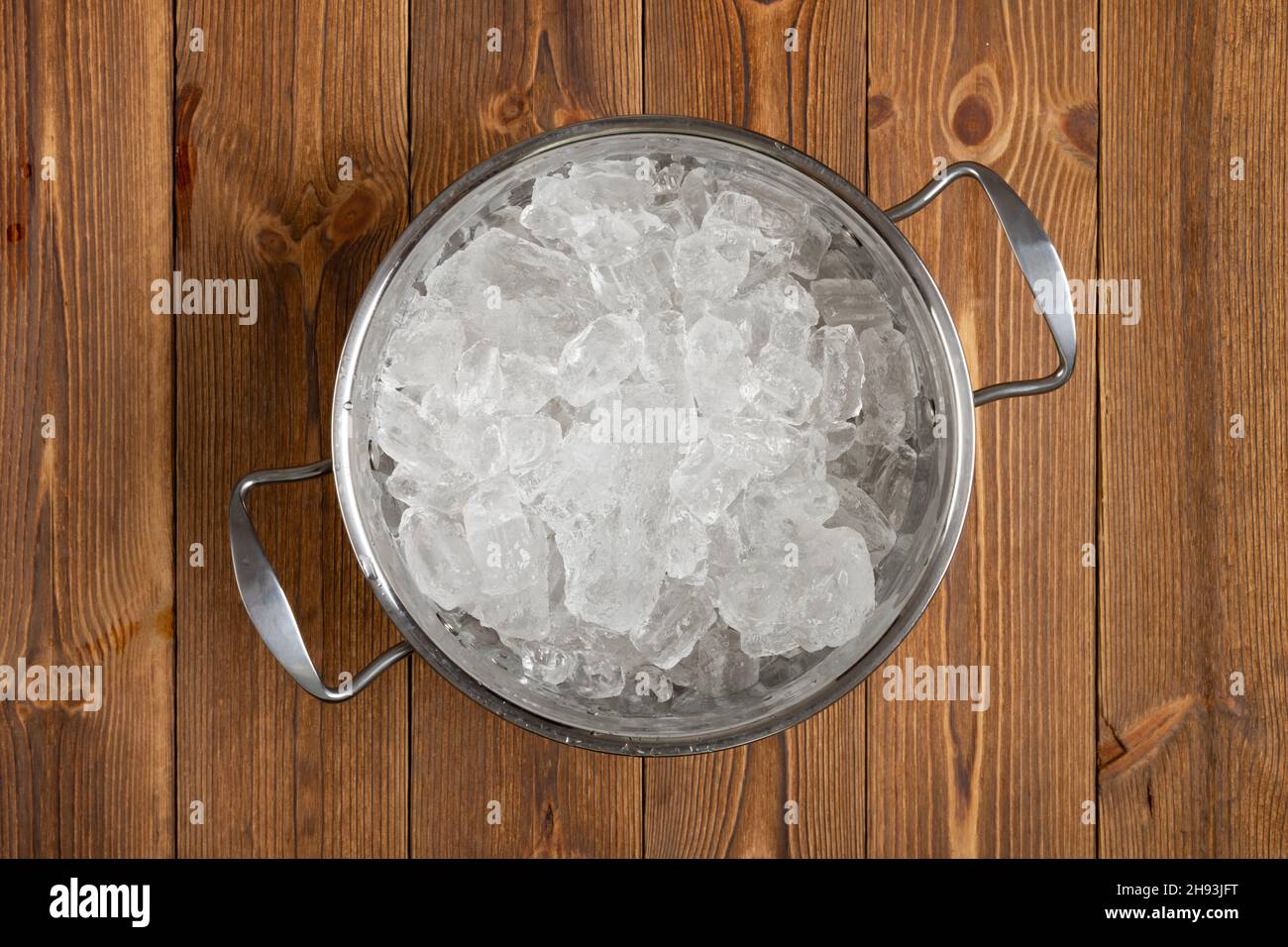 top view ice bucket on a wood table Stock Photo - Alamy