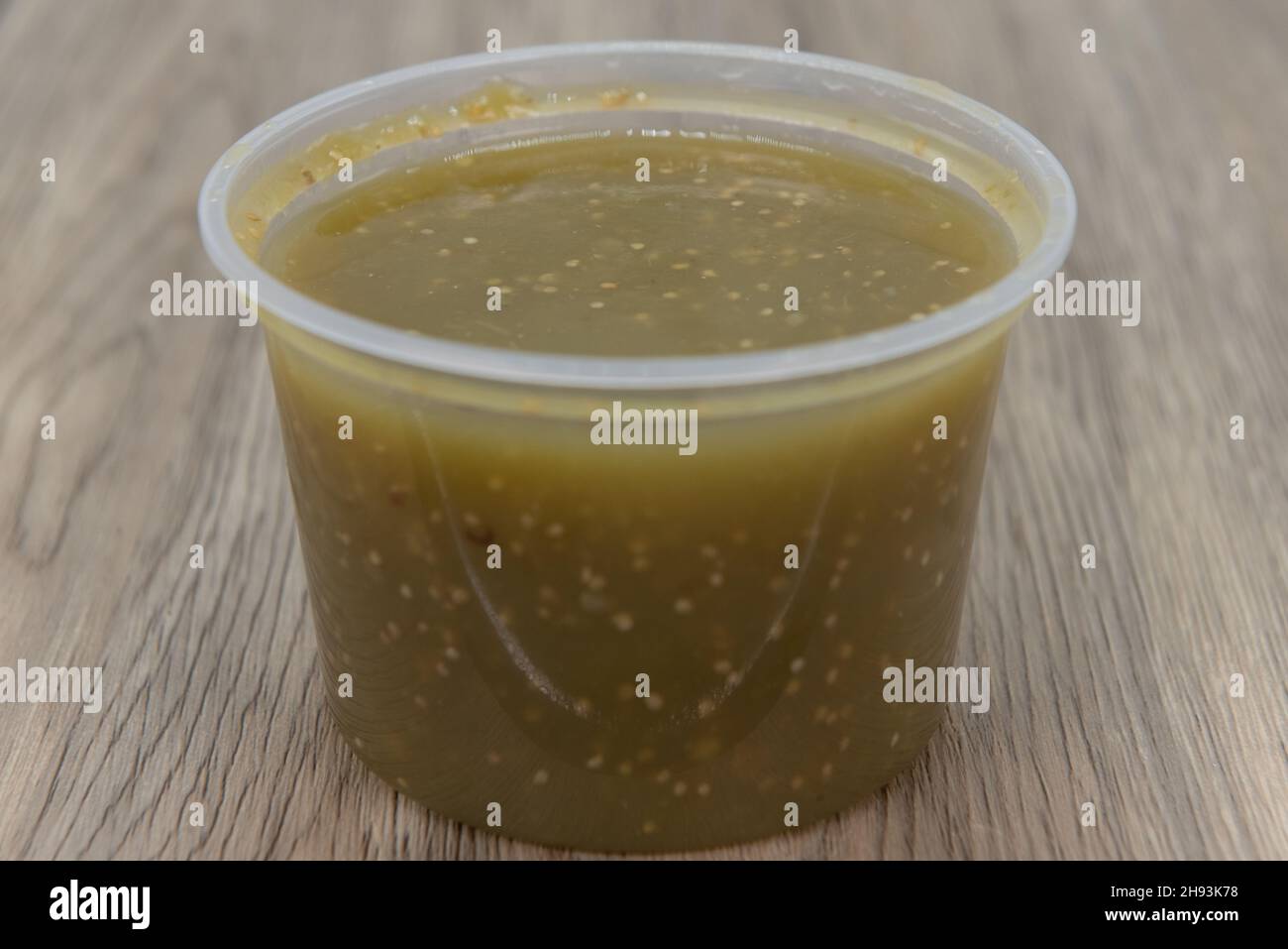 Large container of fresh homemade red salsa ready to serve as a dip ...