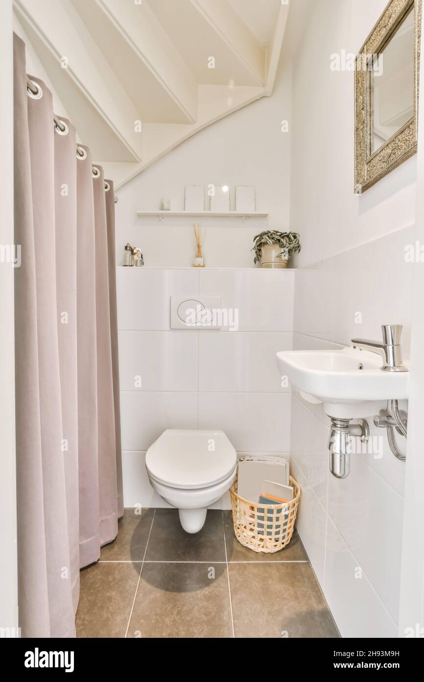 Luxurious washroom with impeccable design and shelf with decors Stock ...