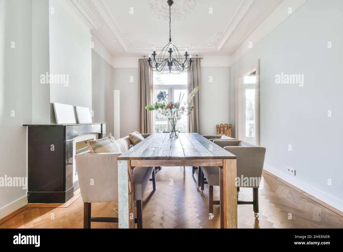 Elegant dining room with large table and comfortable soft chairs Stock ...