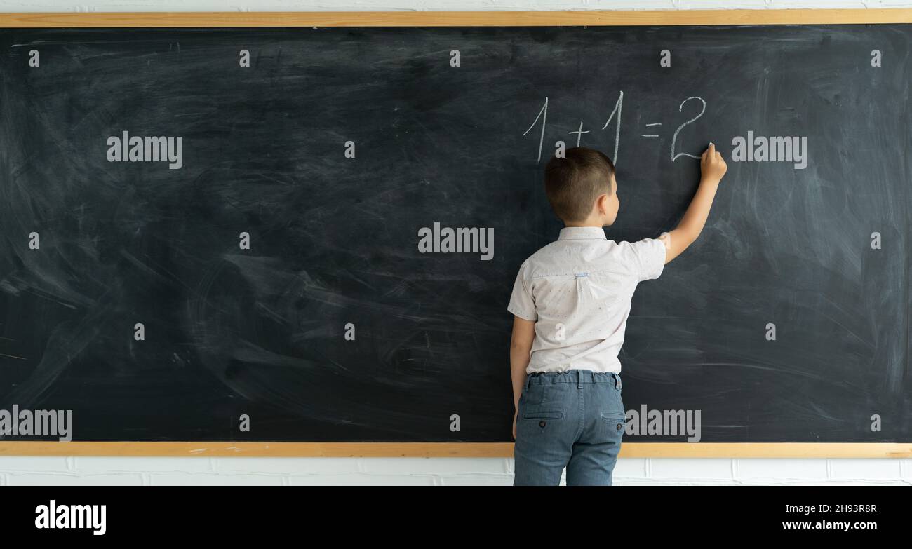 Back view boy student drawing hi-res stock photography and images - Alamy