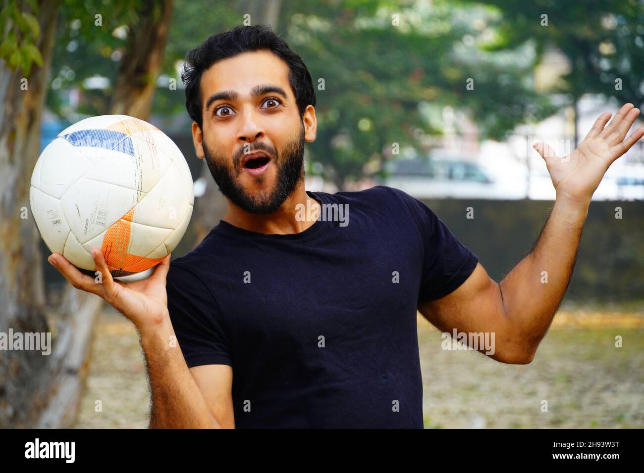 Excited boy football player Holding Ball asian footballer image Stock ...
