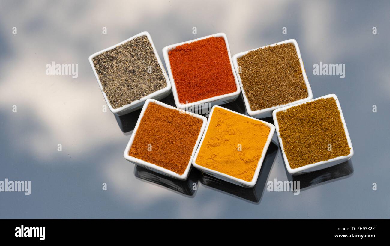 Colorful spices for cooking: Chilli, turmeric, pepper, curry powder etc ...
