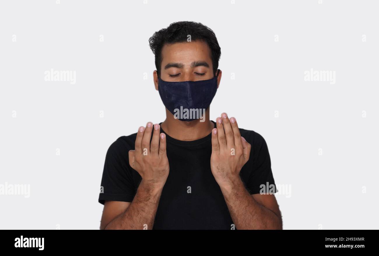 Muslim Man praying to allah Wearing mask Stock Photo - Alamy
