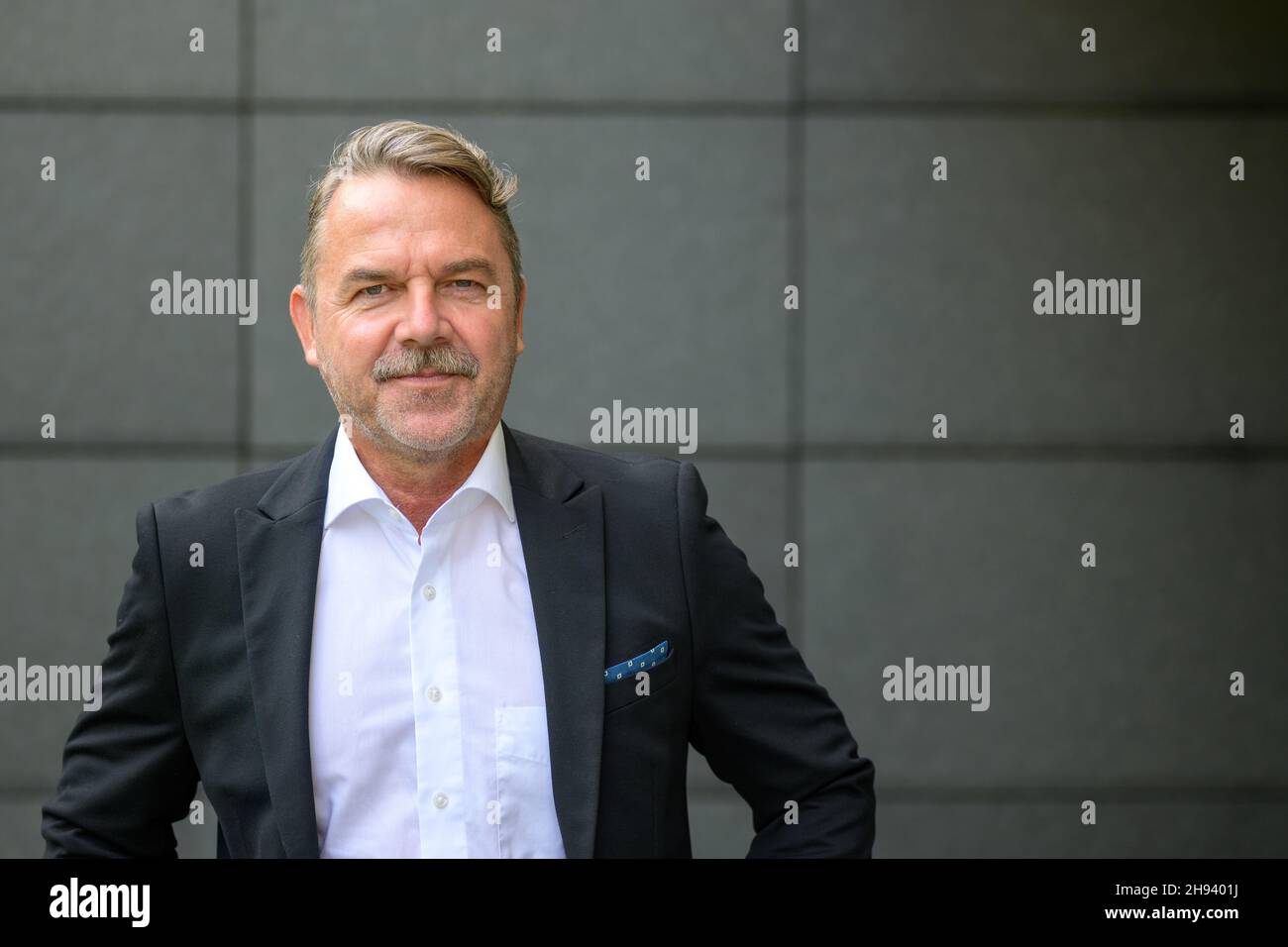 Side view portrait of a serious handsome middle-aged man wearing ...