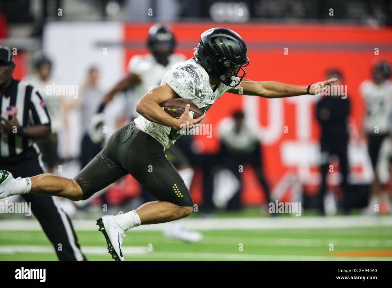 December 03, 2021: Oregon Ducks running back Travis Dye (26) leaps ...