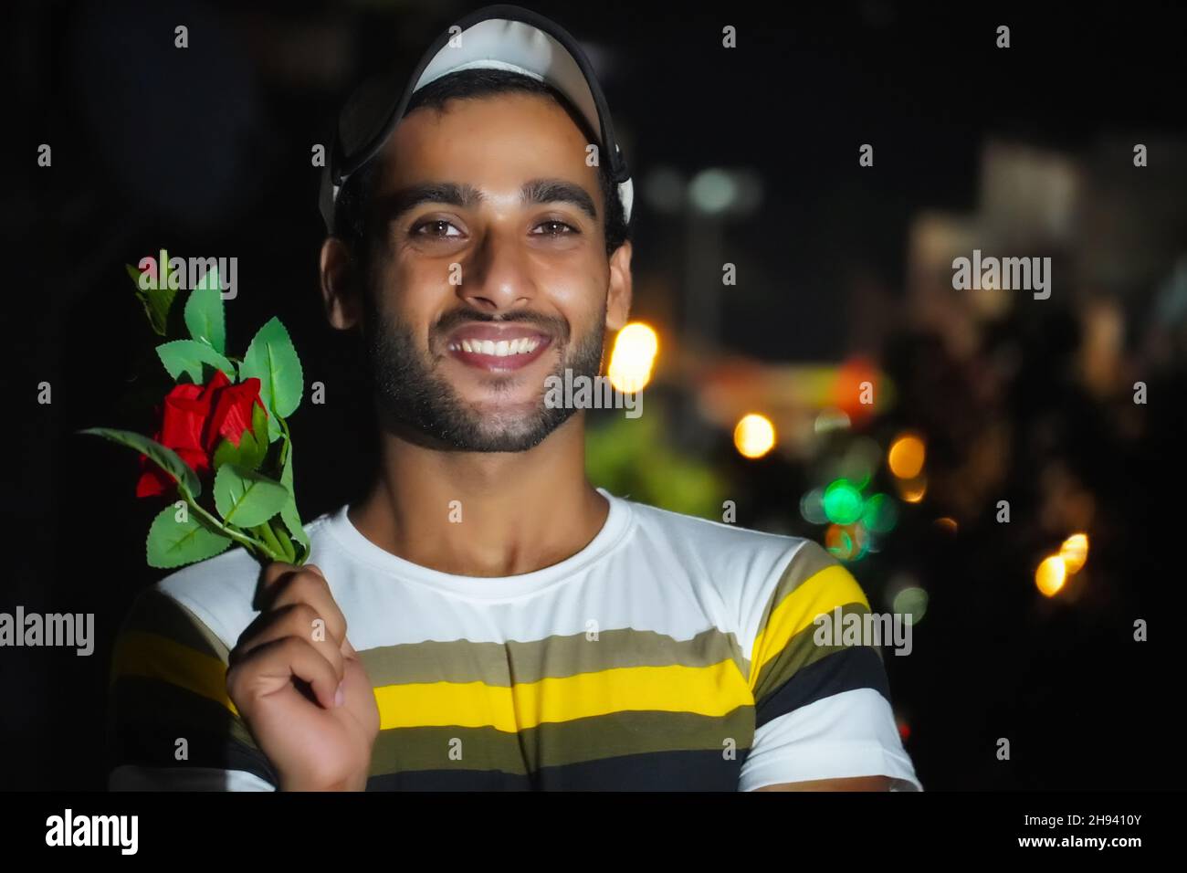 Man red rose in hand hi-res stock photography and images - Alamy