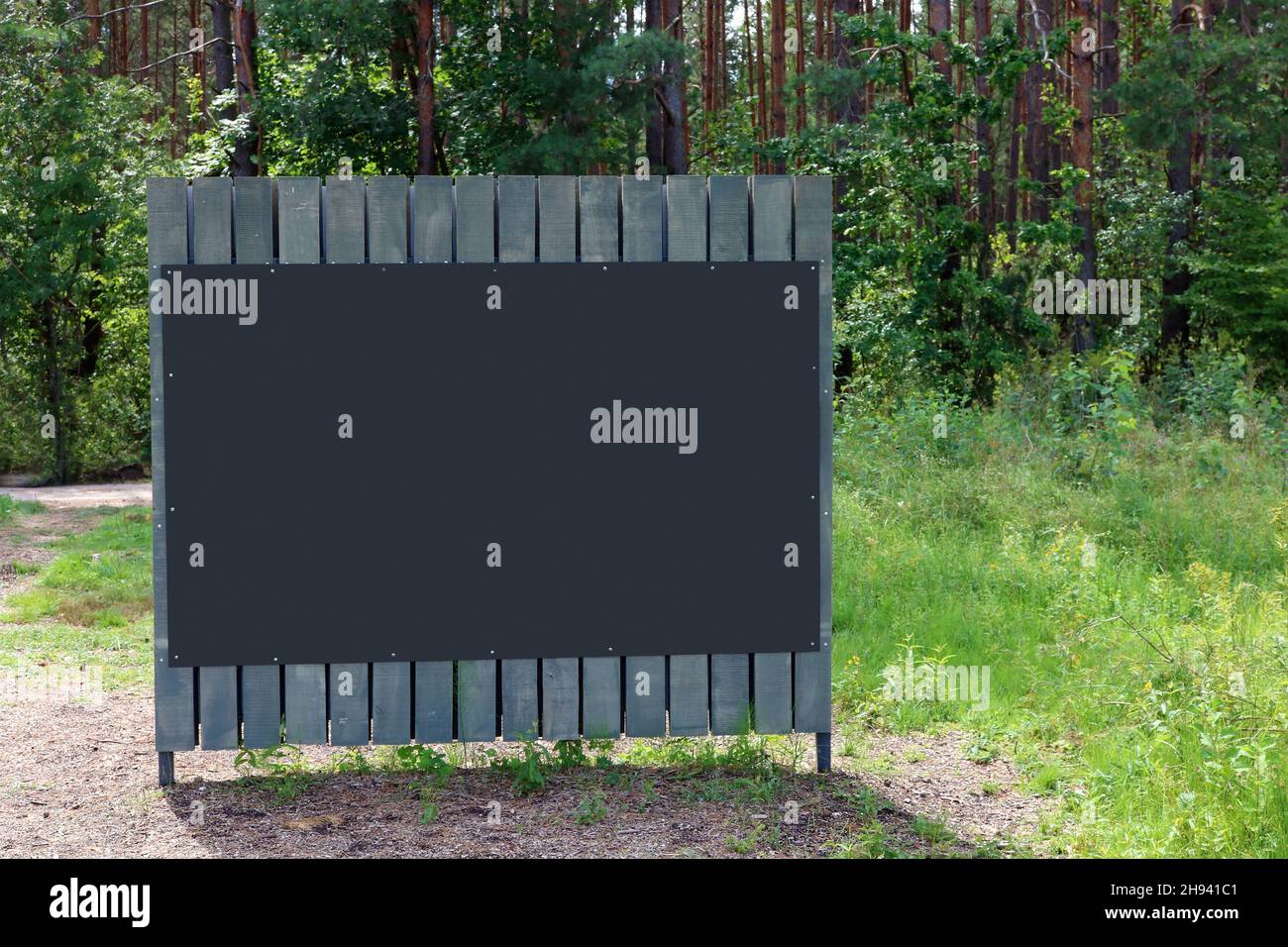Wooden stand for information installed in forest Stock Photo - Alamy