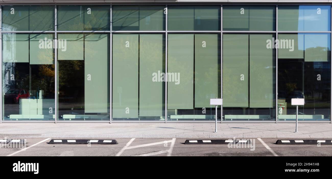 Empty car parking near the new office building with glass windows Stock ...