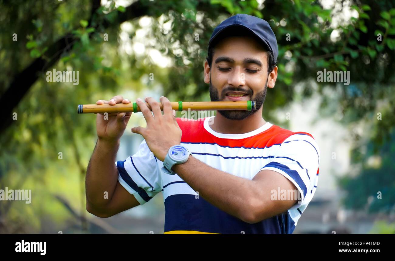 Young woman playing flute hi-res stock photography and images - Alamy