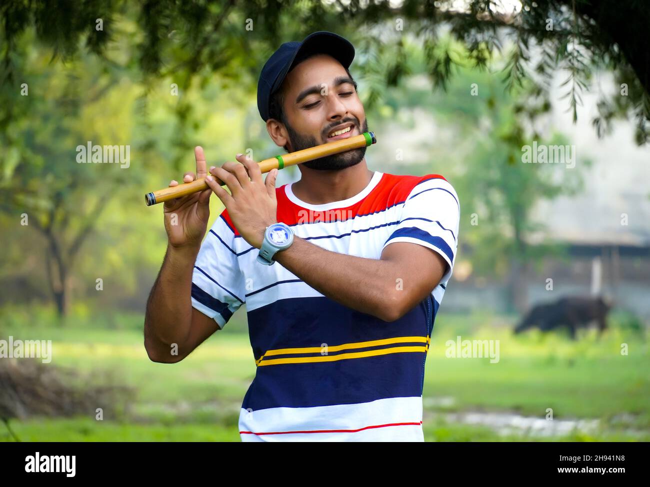Young woman playing flute hi-res stock photography and images - Alamy