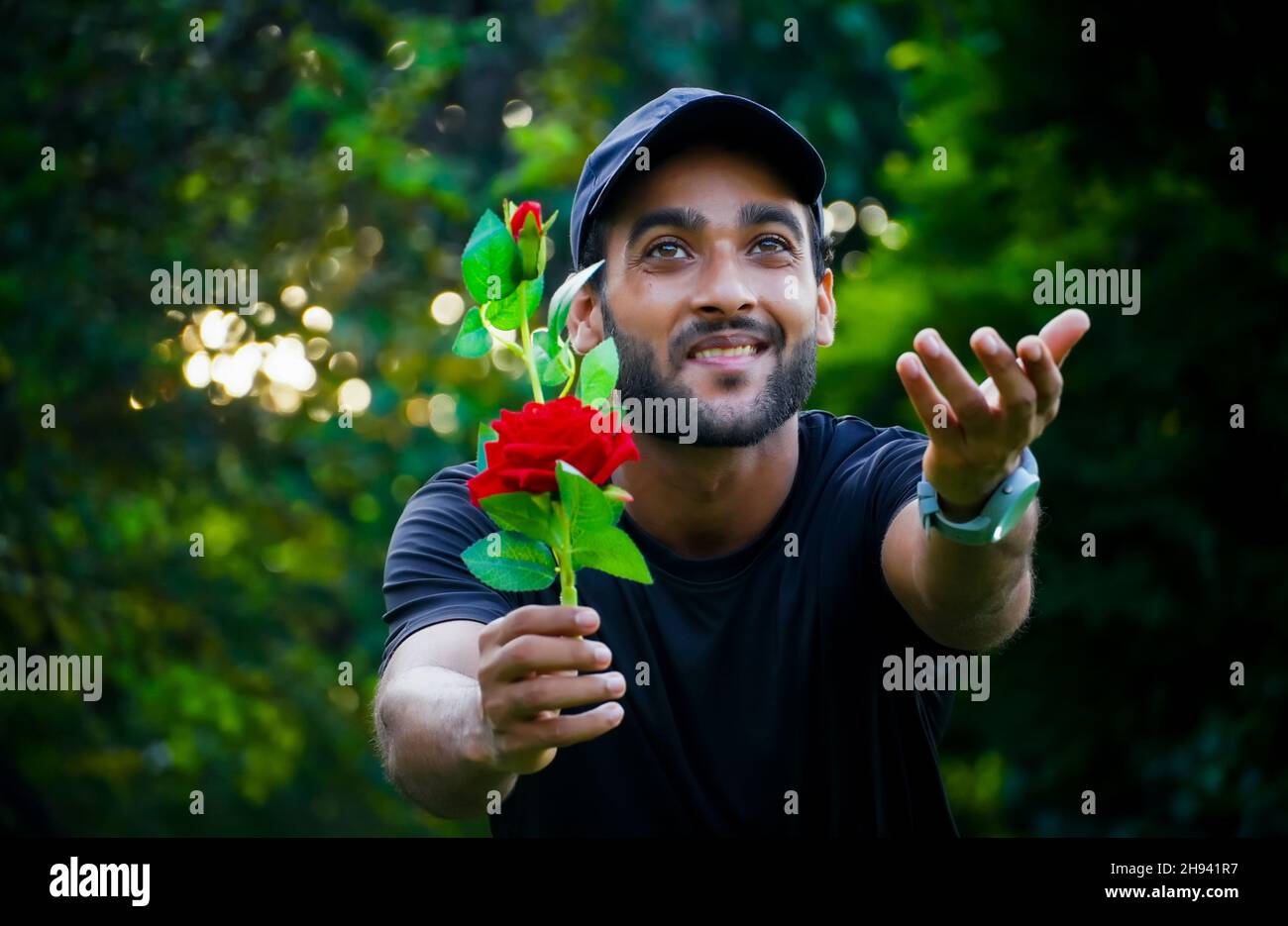 proposing to his Girlfriend man with beautiful red rose giving to girl ...