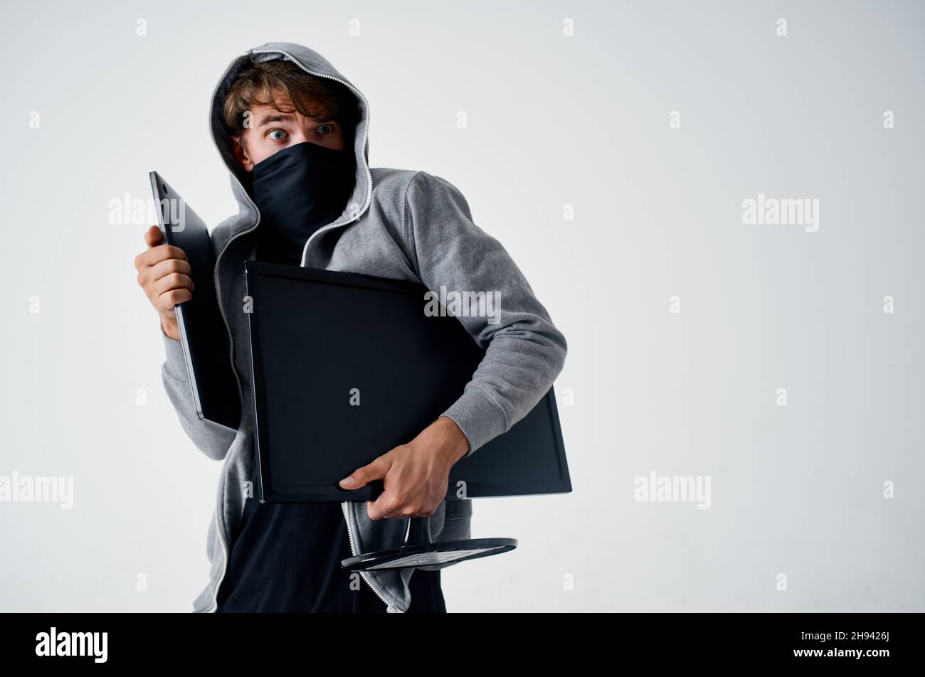 hacker stealth technique robbery safety hooligan light background Stock ...