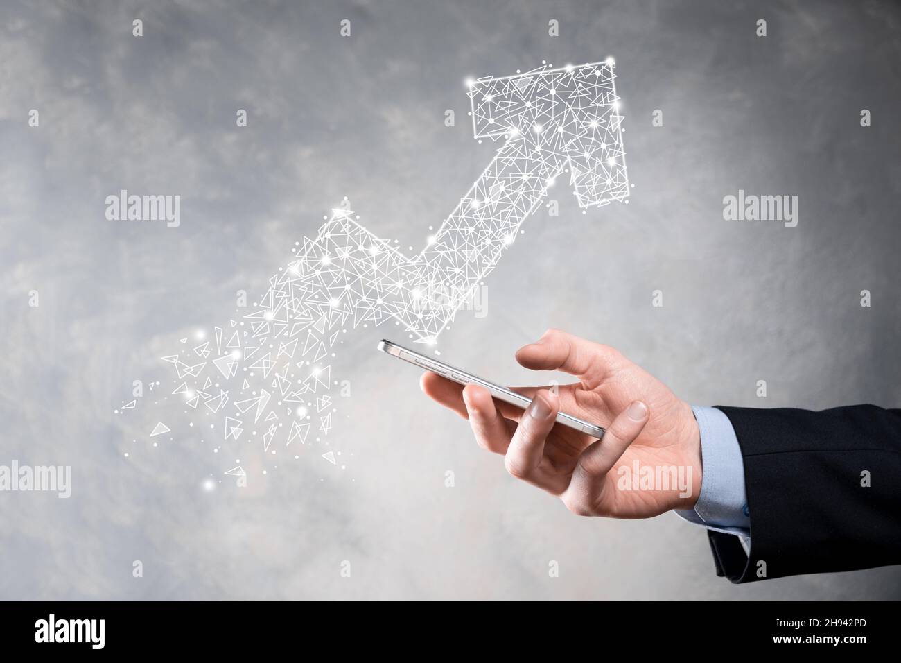 Businessman hold graph, arrow of positive growth icon.pointing at ...