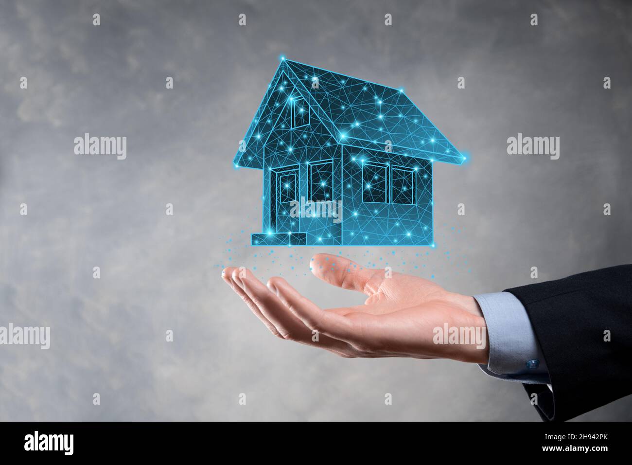 Man hold low polygon.Real estate concept, businessman holding a house ...