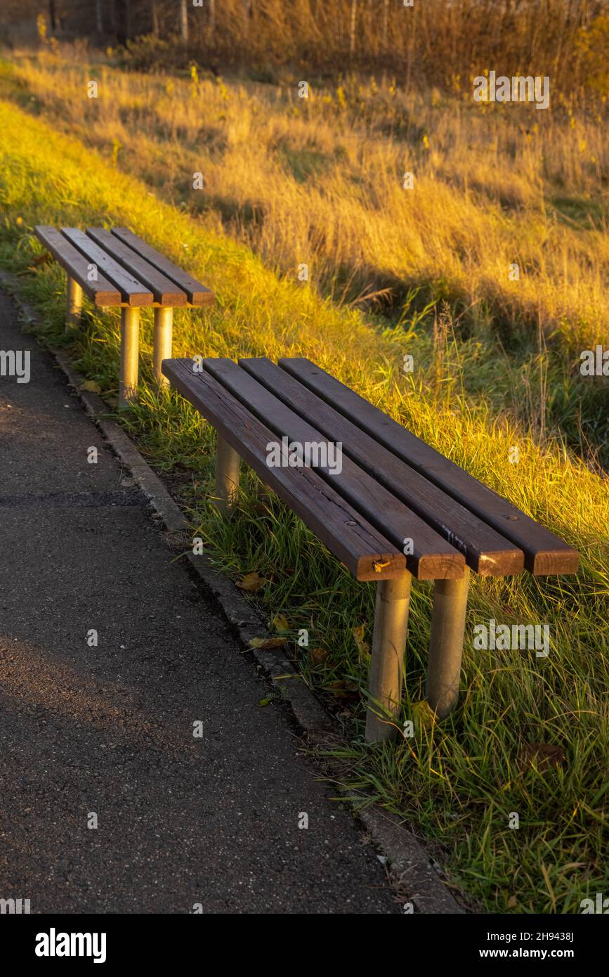 Wooden benches for site seeing and to get rest in the park with warm ...