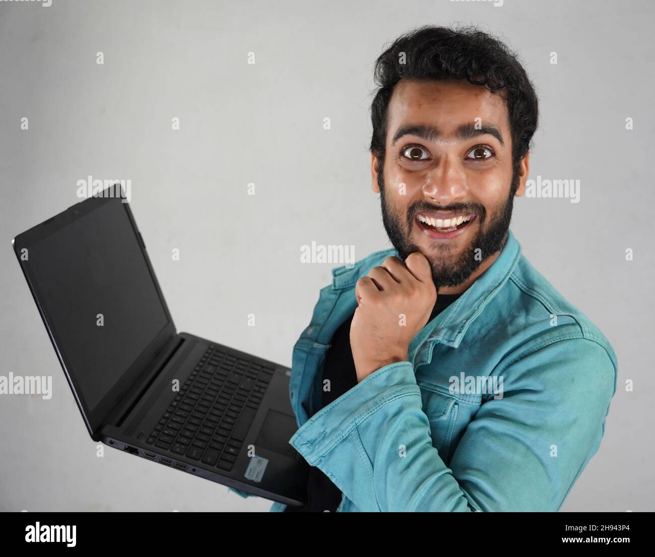 Young Indian boy with a laptop Stock Photo - Alamy