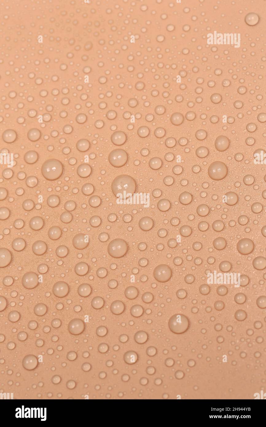 cosmetic pastel concept. Water drops on beige background Stock Photo ...