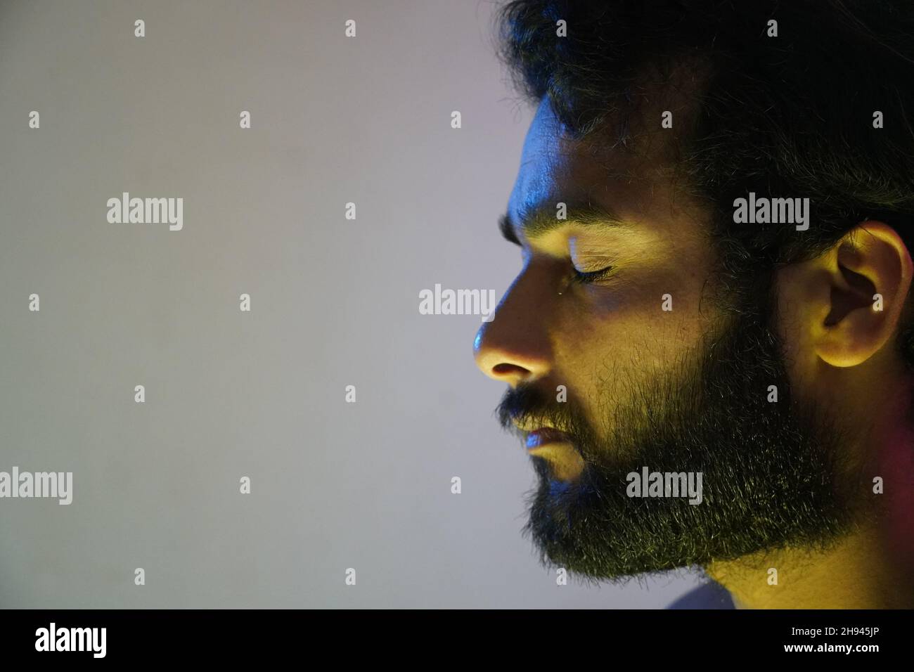 a young man crying alone and sad face Stock Photo - Alamy
