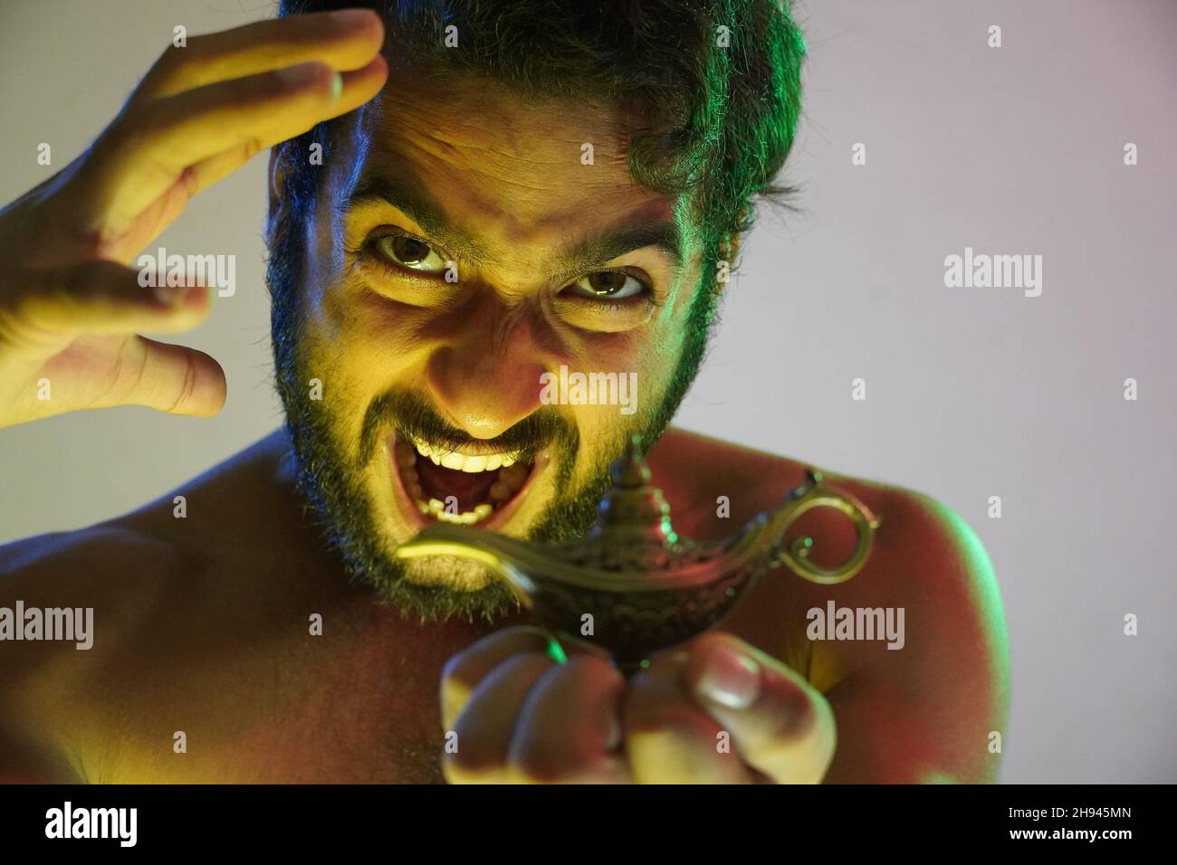 a young angry man with magical lamp and feeling angry like a king want ...