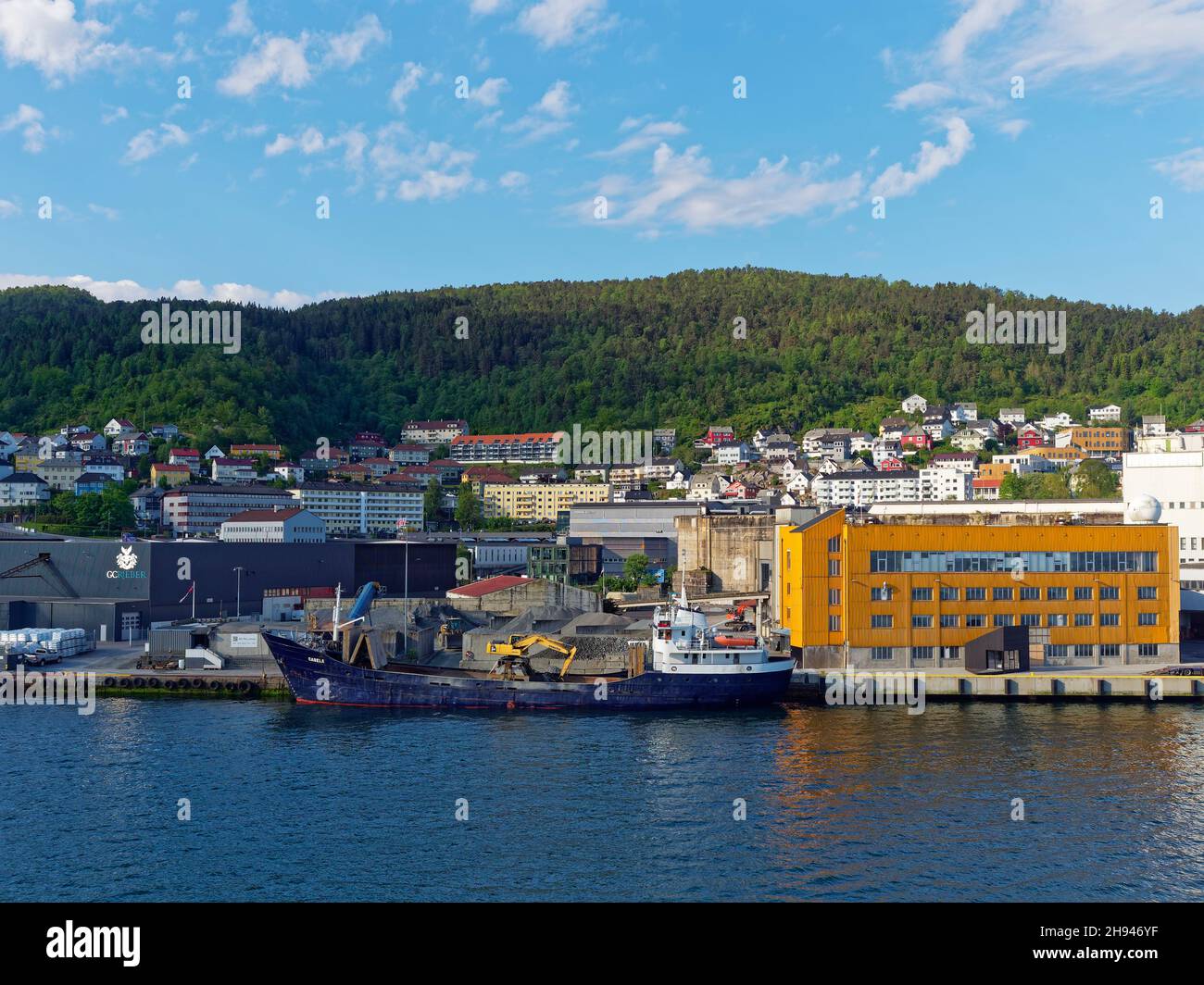 The Cabela, a General Cargo Vessel unloading its gravel cargo next to ...