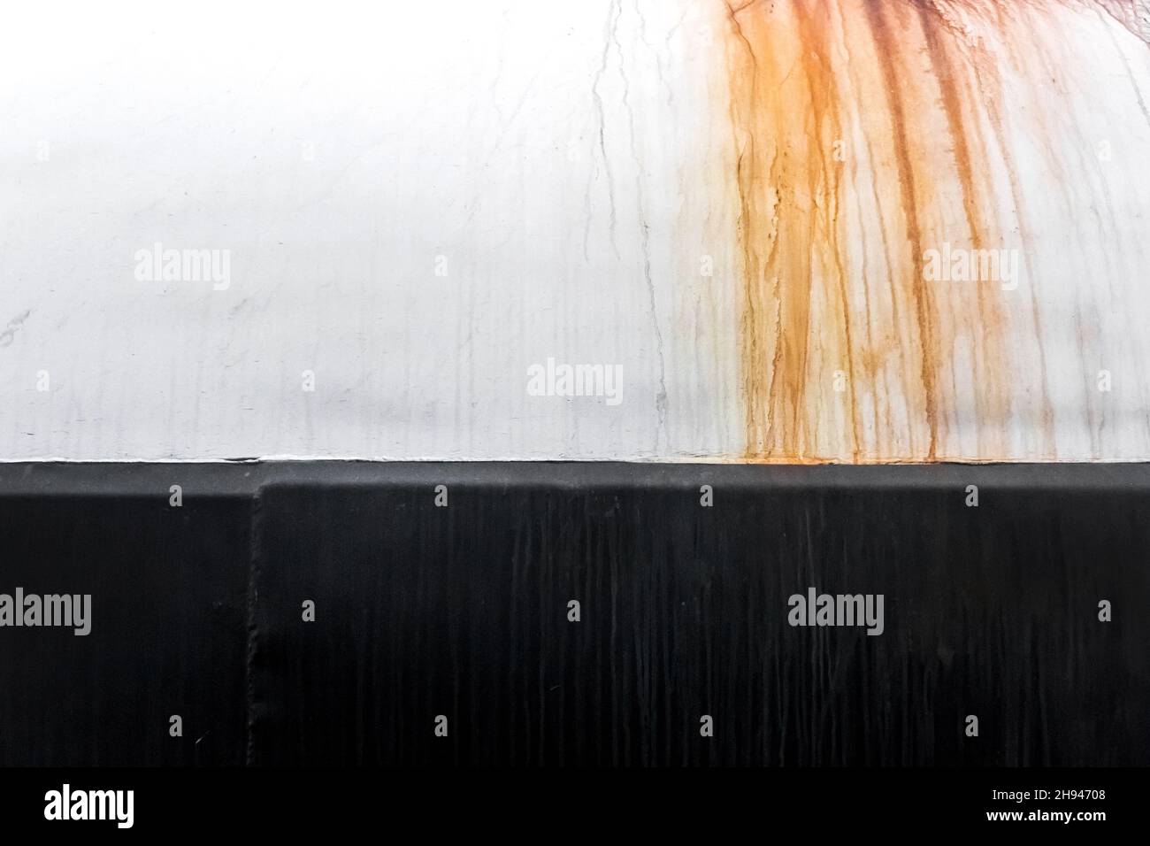 A railway tank truck barrel with dirty rusty traces of chemical liquid ...