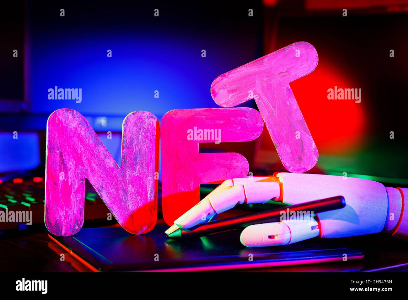 NFT Non-Fungible token. Artificial hand creates crypto art using a ...