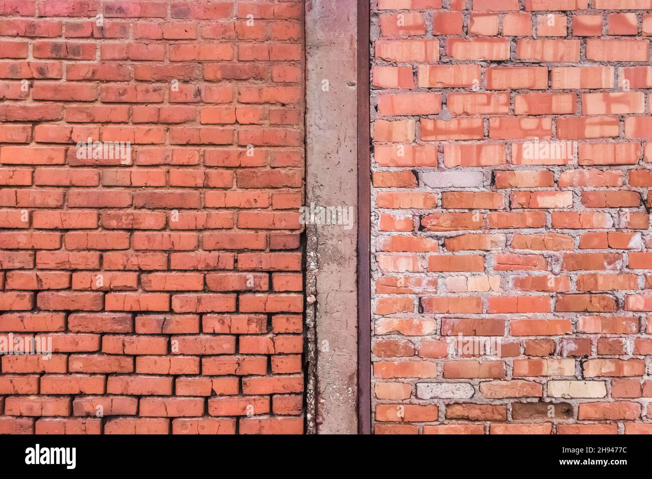 Concrete partition border and line of two old dirty reddish brown worn ...