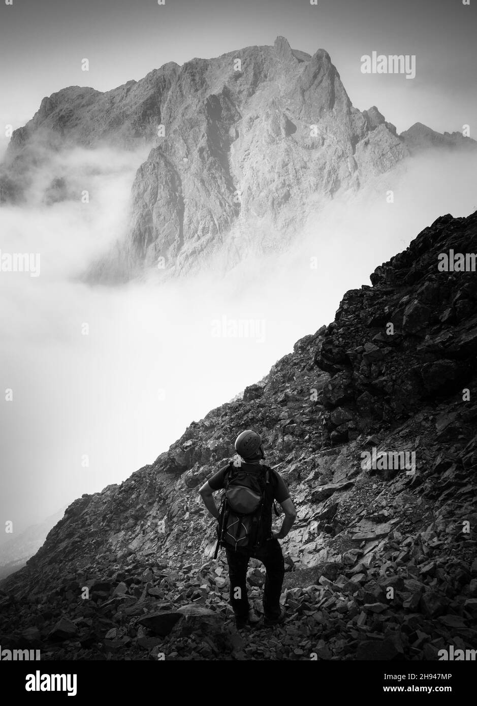 Climber decending the Great Stone Chute, Cuillin Mountains Stock Photo ...