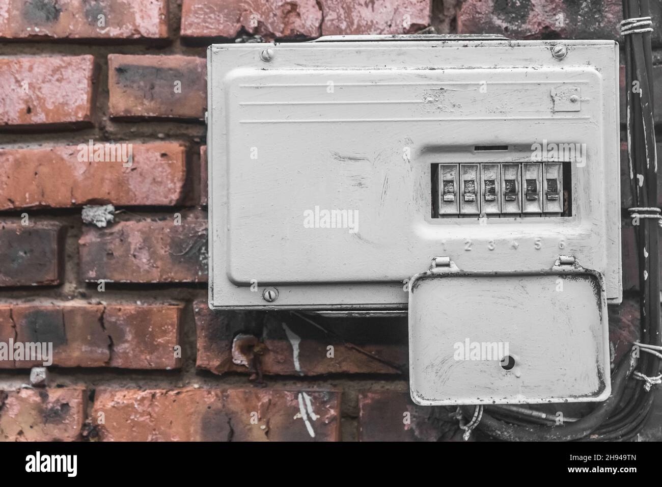 The old broken electrical panel or box of the drawer on the wall ...