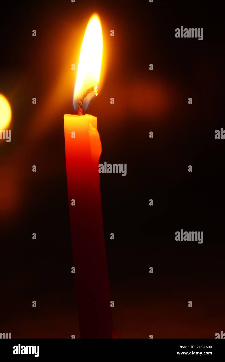 candle in low light alone sad concept Stock Photo - Alamy