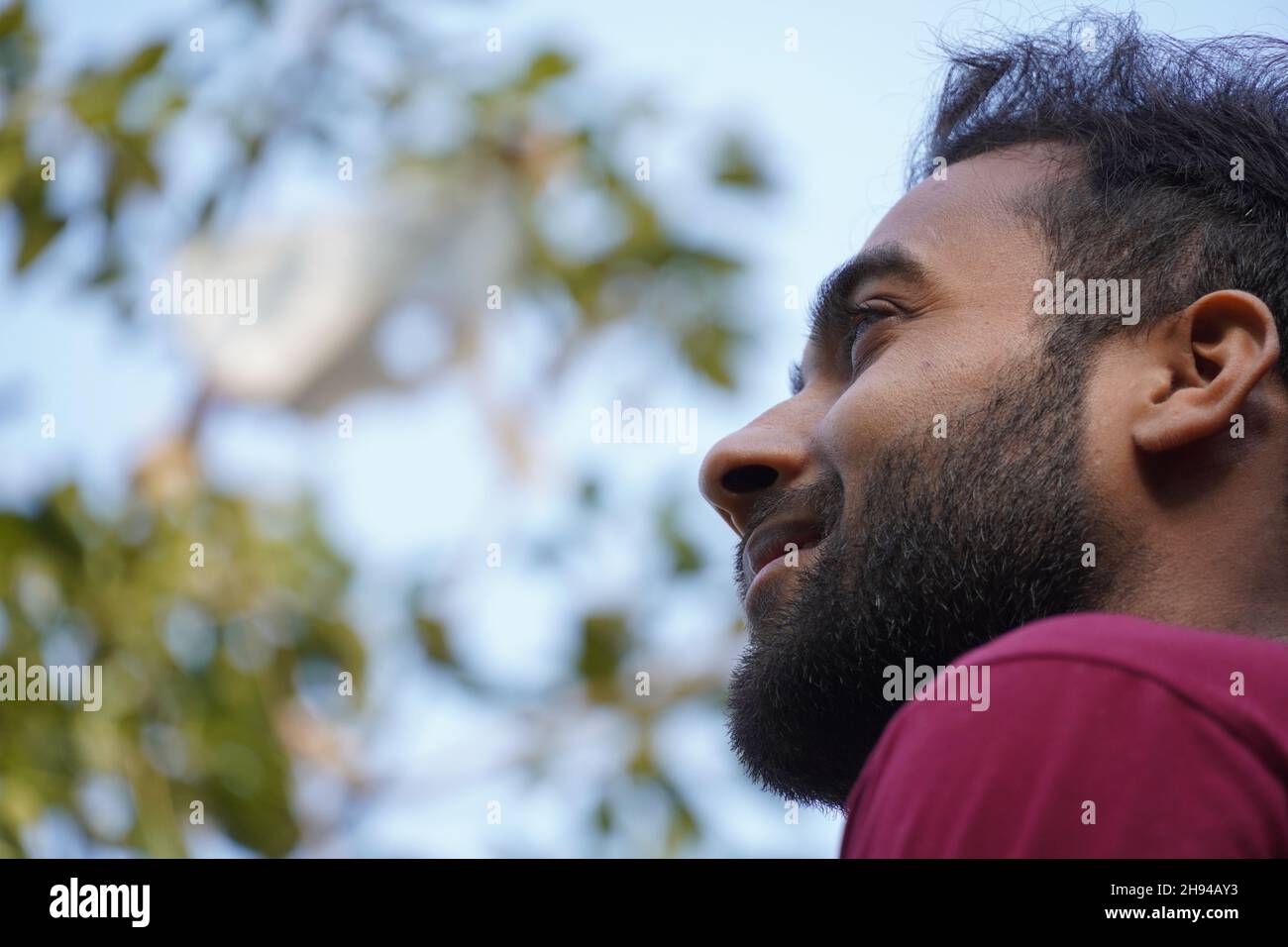 Half-turned side profile close up view portrait of handsome virile ...