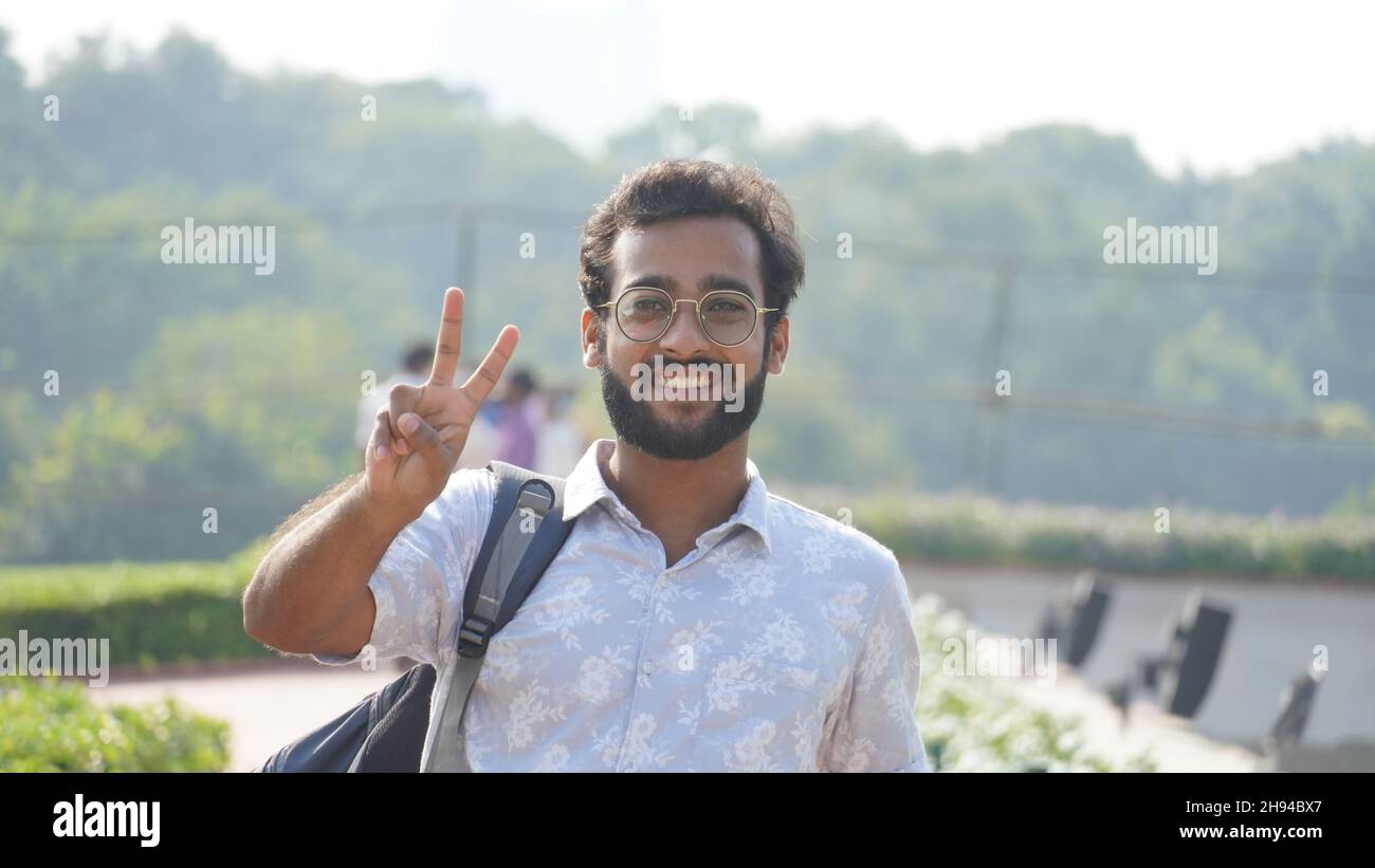 Sign victory young man standing hi-res stock photography and images - Alamy