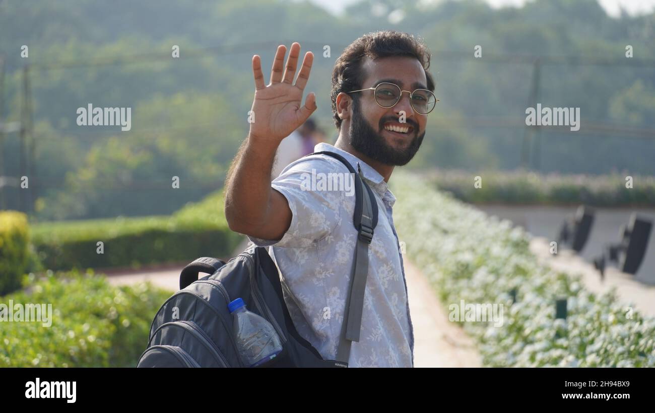 Portrait attractive young man saying hi-res stock photography and images - Alamy