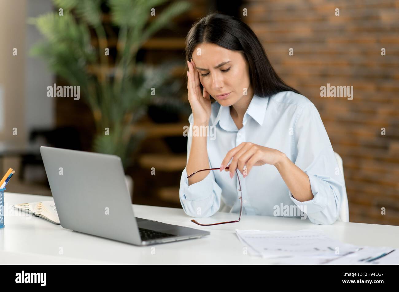 Exhausted caucasian woman, manager, secretary, tired of working with ...