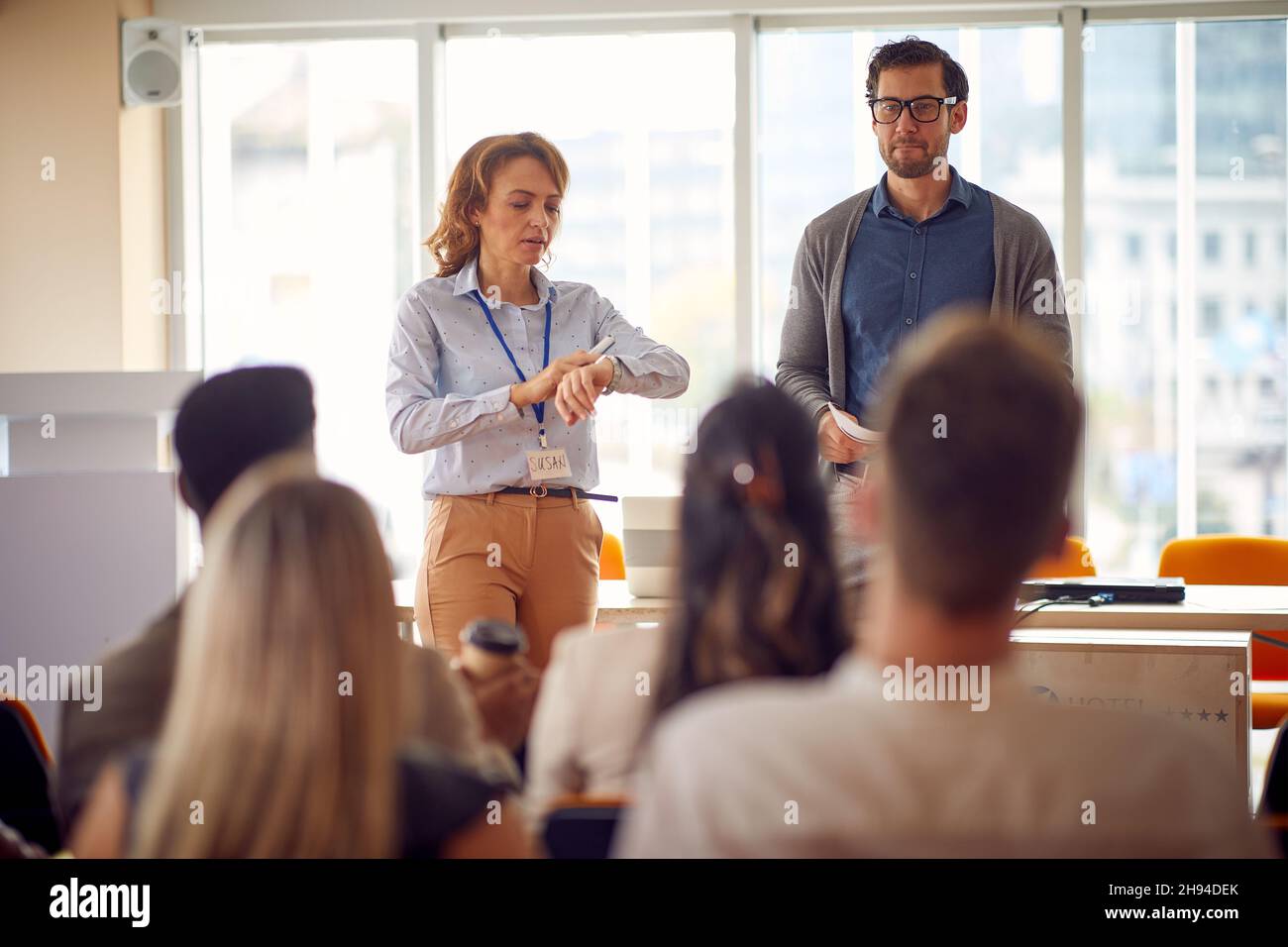 Two business colleagues are giving a business lecture in a working ...