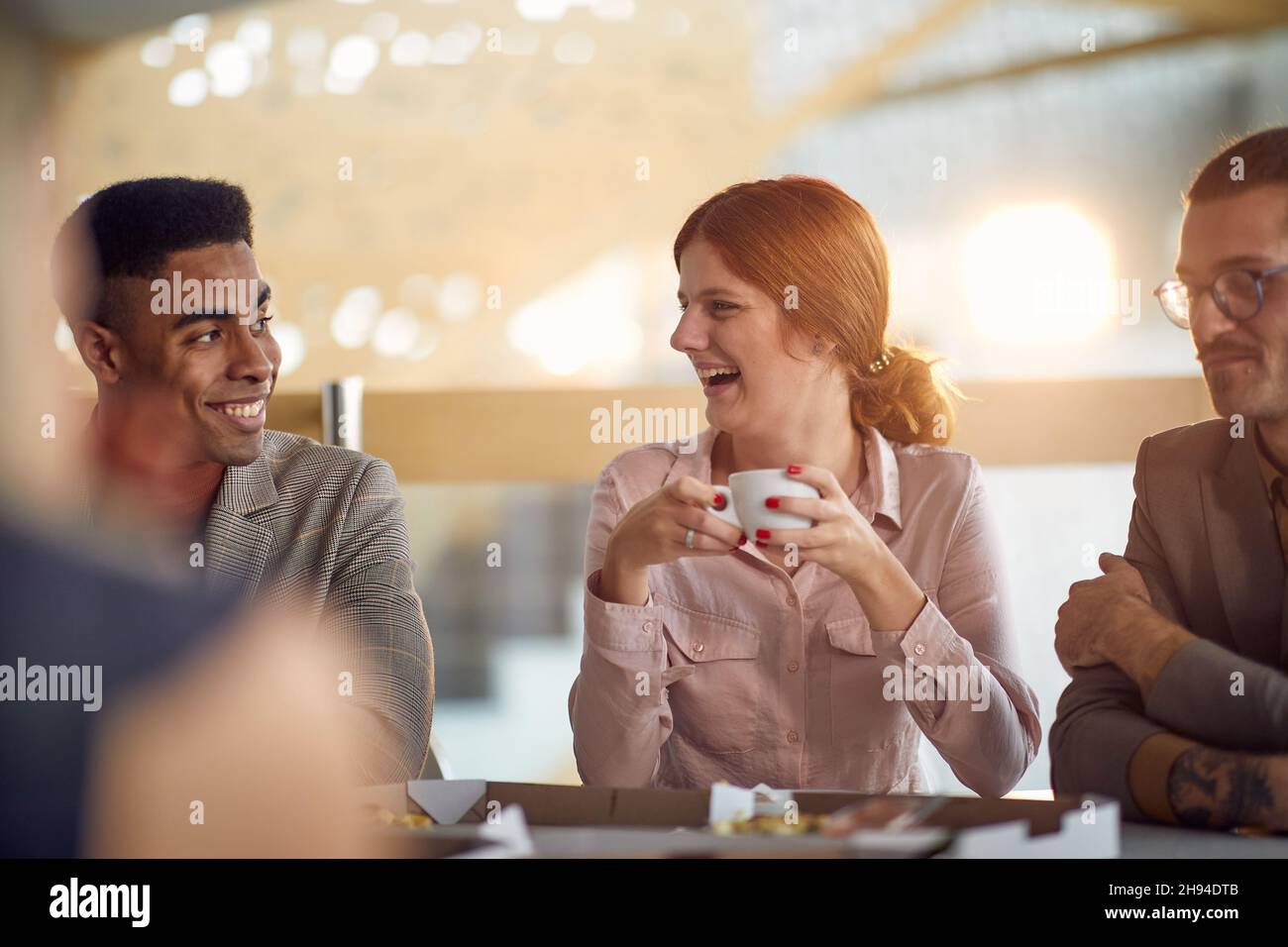 Happy business people talking and laughing together Stock Photo - Alamy