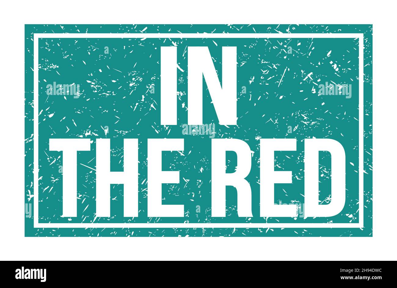 IN THE RED, words written on blue rectangle stamp sign Stock Photo - Alamy