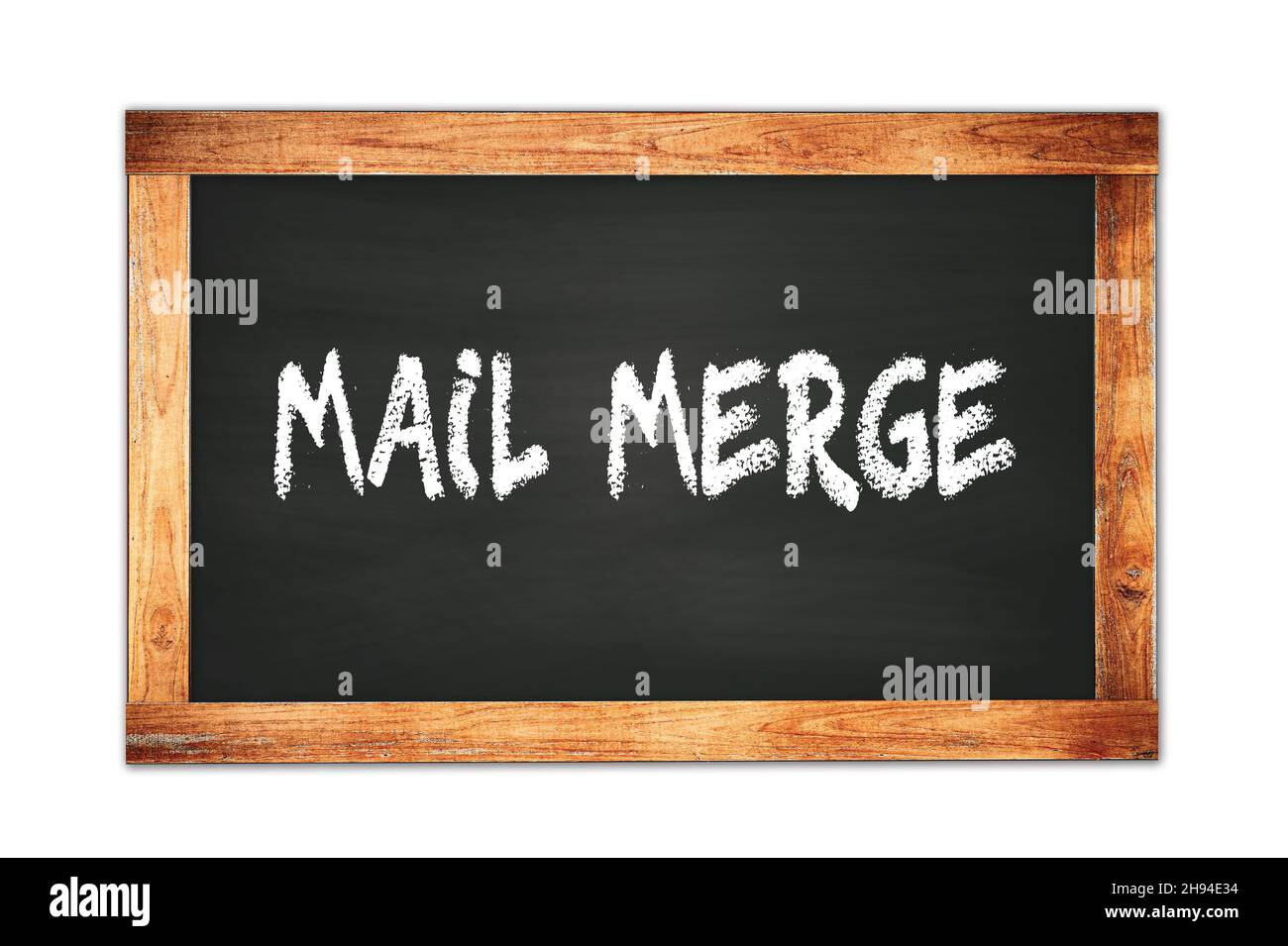 MAIL MERGE text written on black wooden frame school blackboard Stock ...