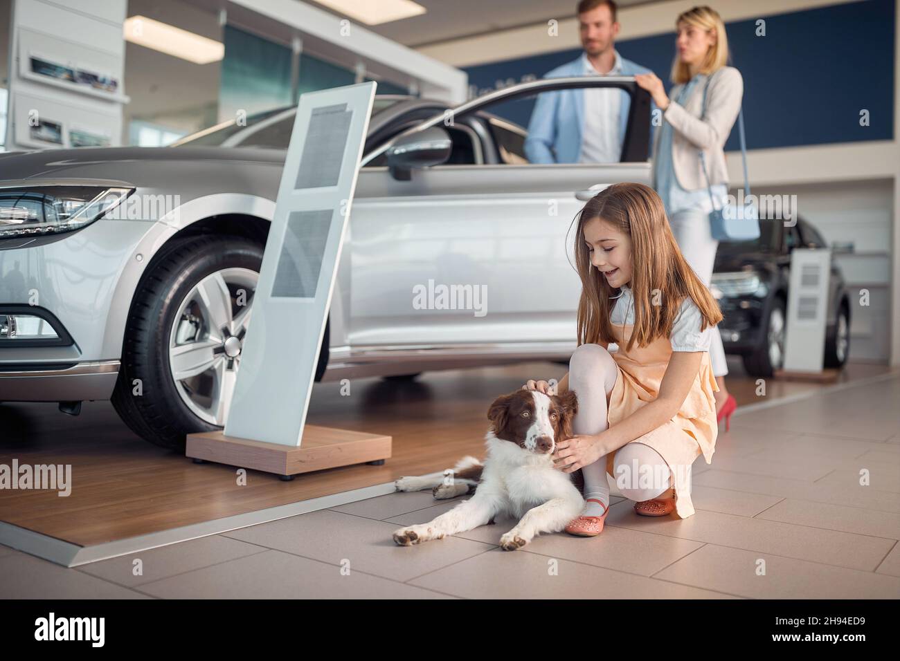 Happy caucasian family renting a new car together for themselves Stock ...