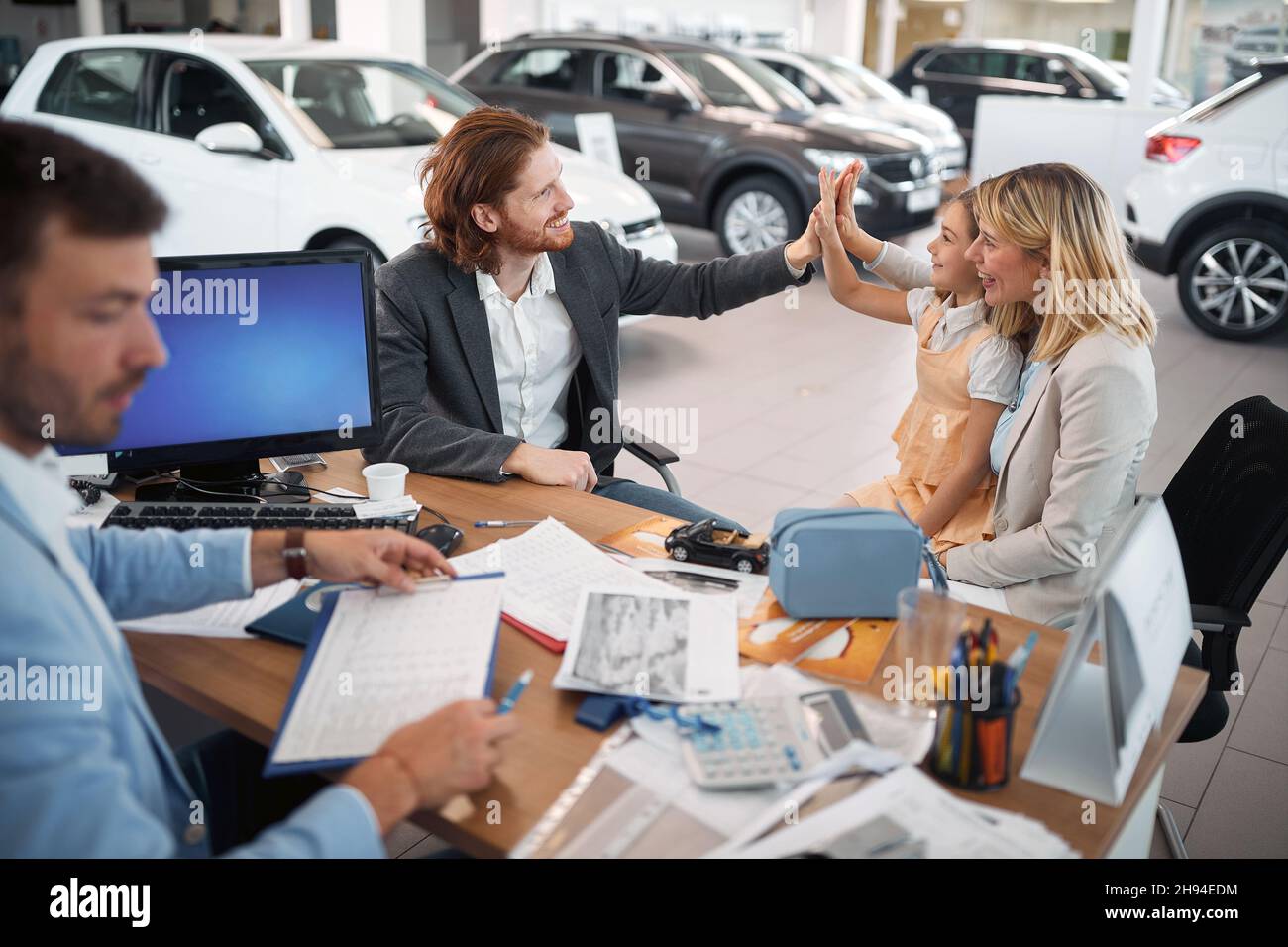 excited family buying a new car.Happy family celebrating just bought a ...
